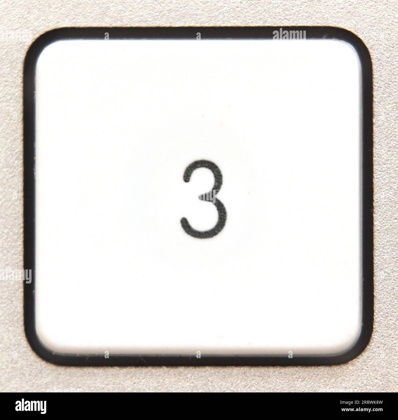 Button 3 from a modern numpad Stock Photo - Alamy