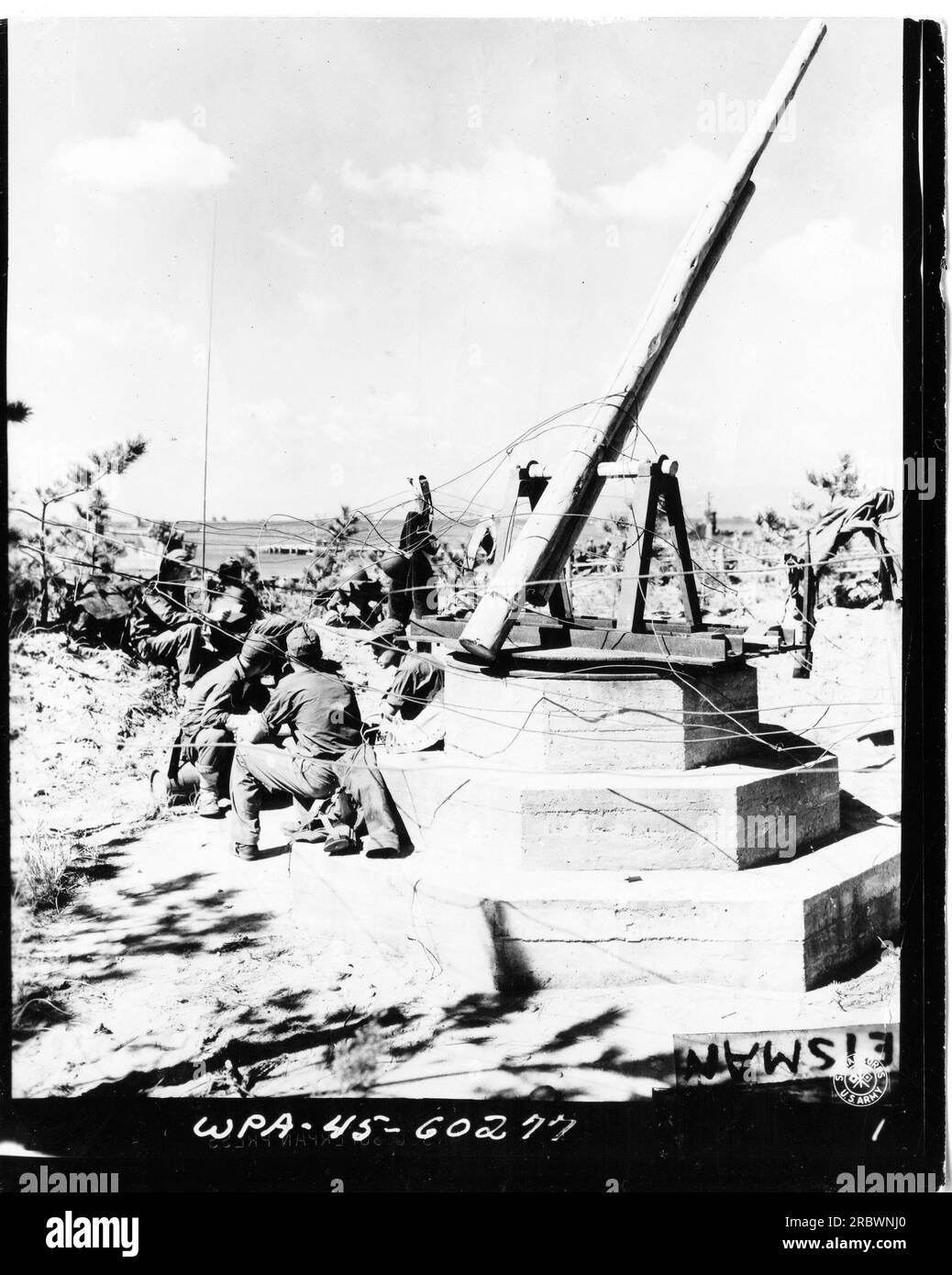 An imitation anti-aircraft gun is seen positioned on the beach of ...
