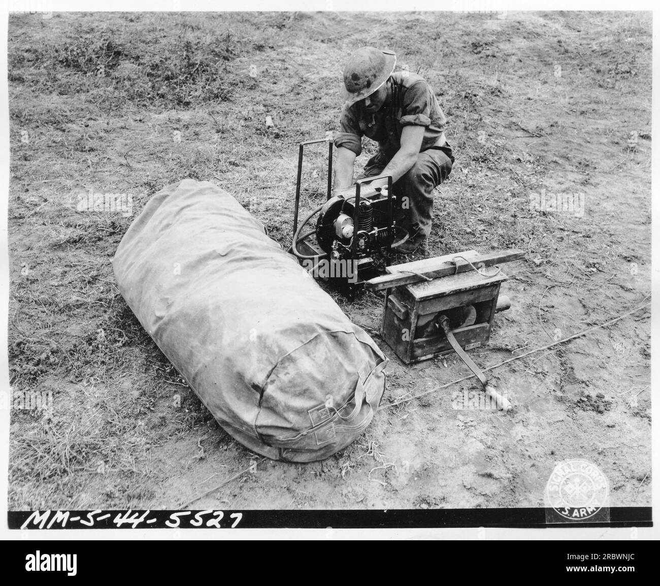 Soldiers inflate a dummy tank, designed by British MM-5-44-5527 AR, as ...