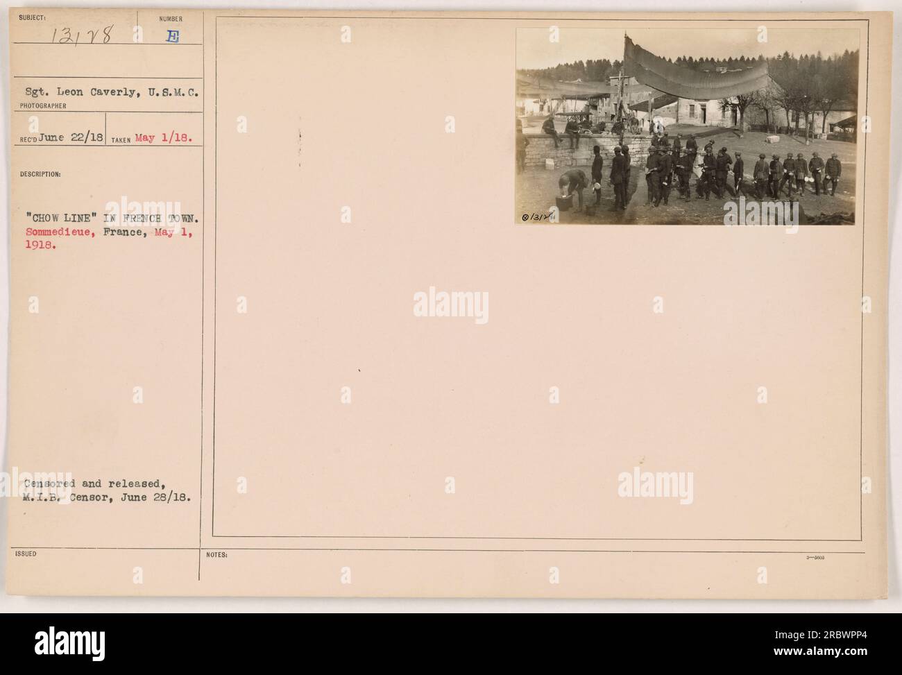 American military personnel waiting in line for food in a French town ...