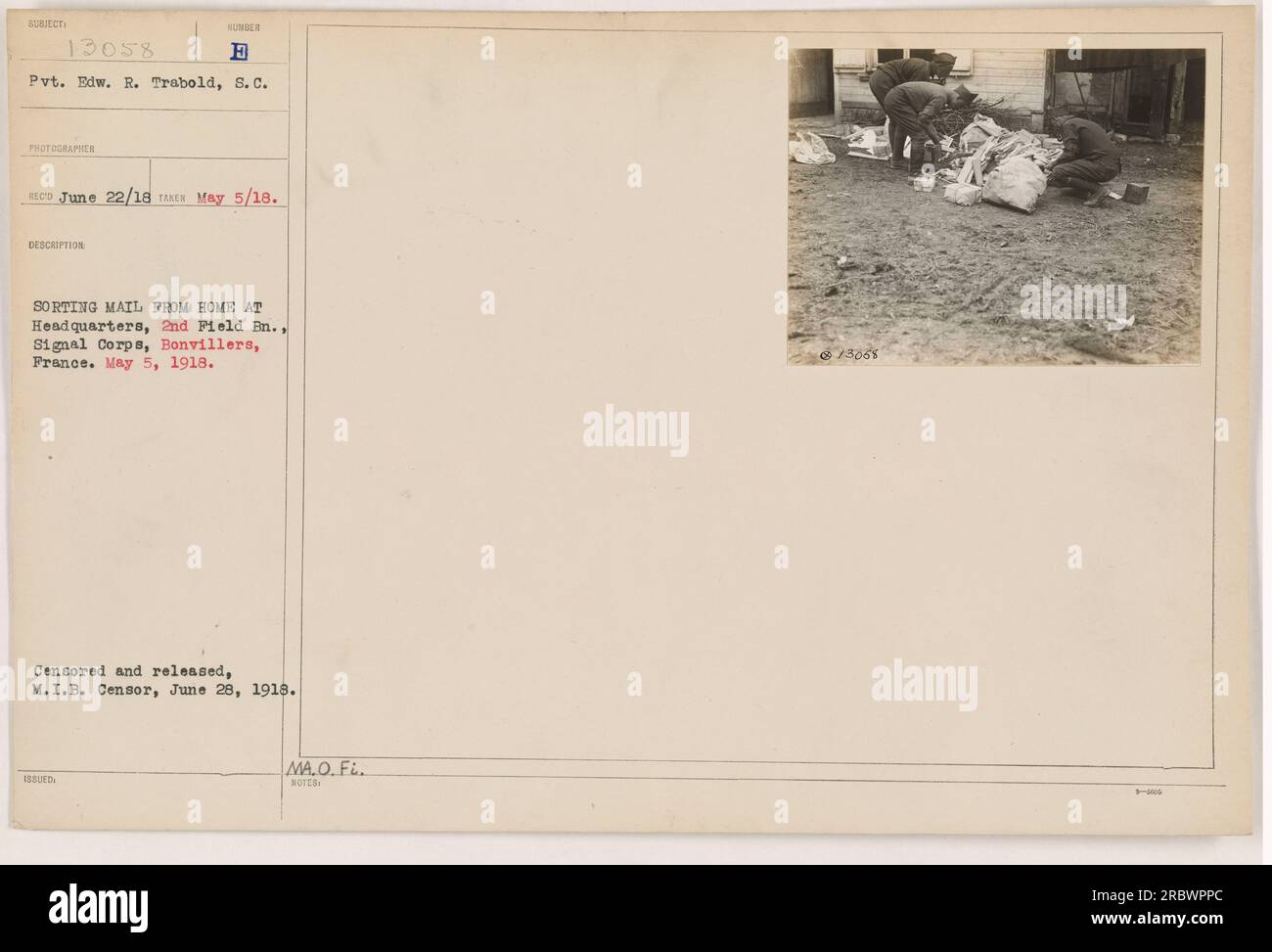 Pvt. Edw. R. Trabold of the Signal Corps is seen sorting mail from home ...