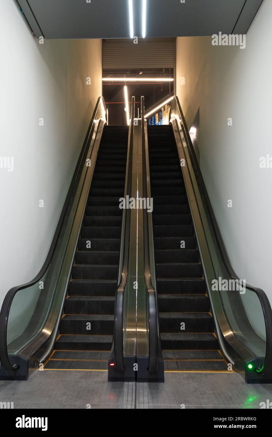 Escalator without people in the mall. Vertical photo Stock Photo - Alamy