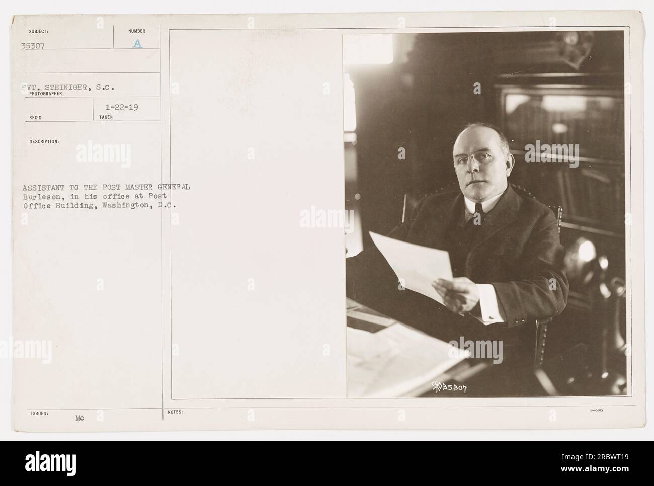 Pvt. Steiniger serves as the photographer's assistant to Post Master ...