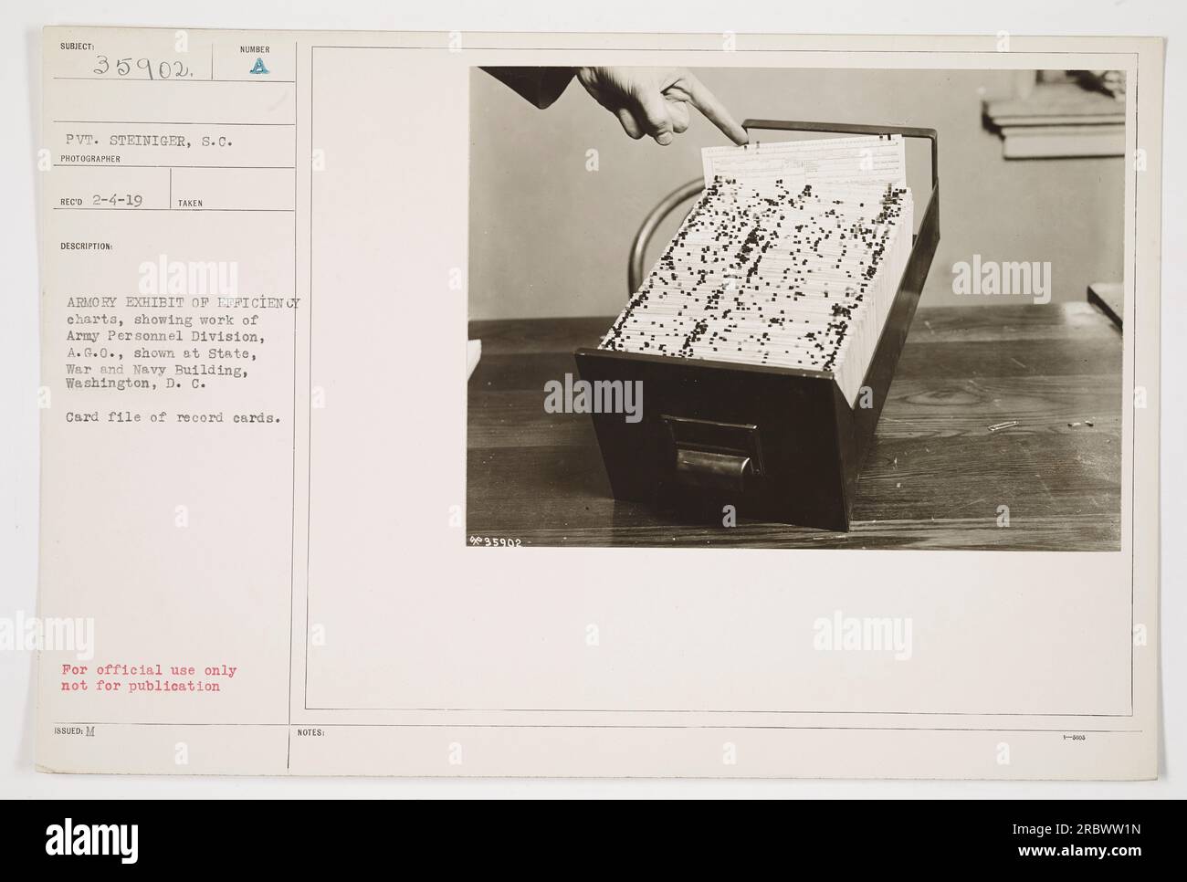 Pvt. Steiniger, a photographer for the Signal Corps, captures an image ...