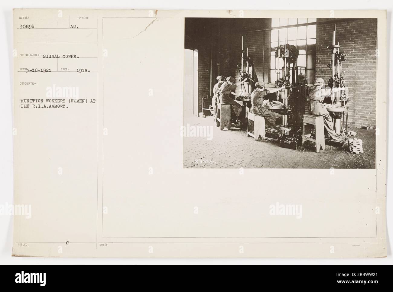 Workers at the R.I.A. Armory receiving their issued munition work taxes ...