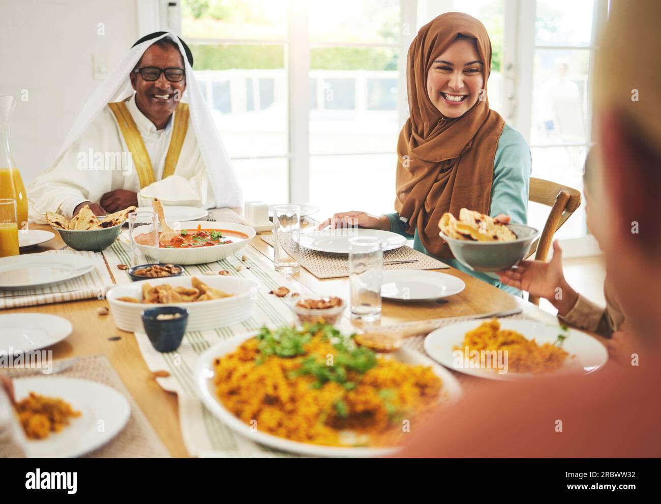 Food, help and muslim with big family at table for eid mubarak, Islamic ...