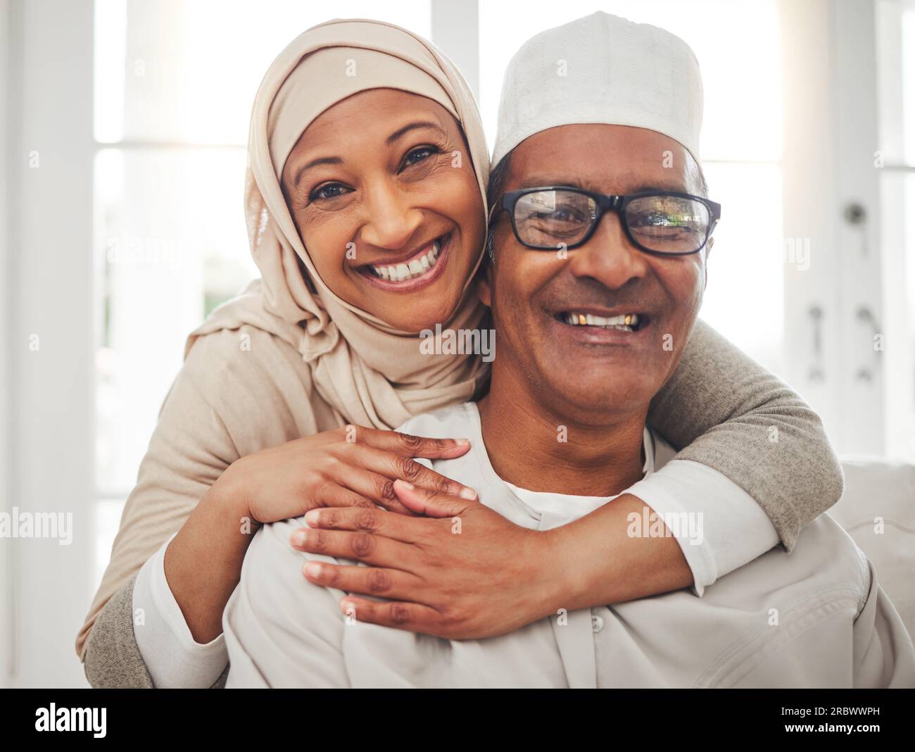 Portrait, Muslim and elderly couple smile, hug and happy for support ...
