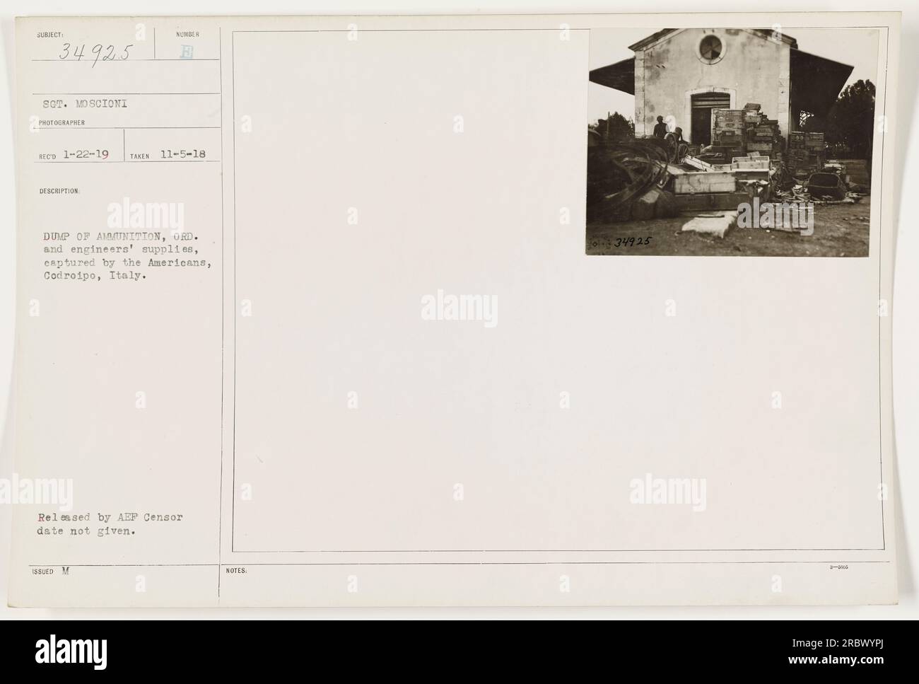 Image of a panel of American soldiers standing in front of a large pile ...