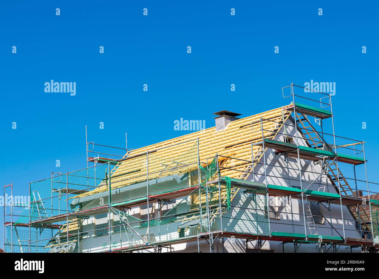 Unfinished roof of a private residential building surrounded by ...