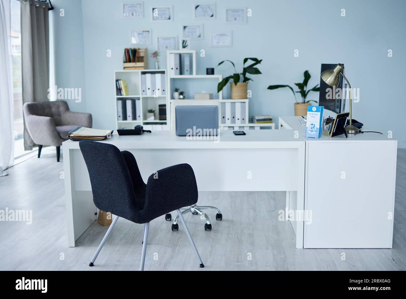 Empty, office of medical doctor and consultation with furniture, table ...