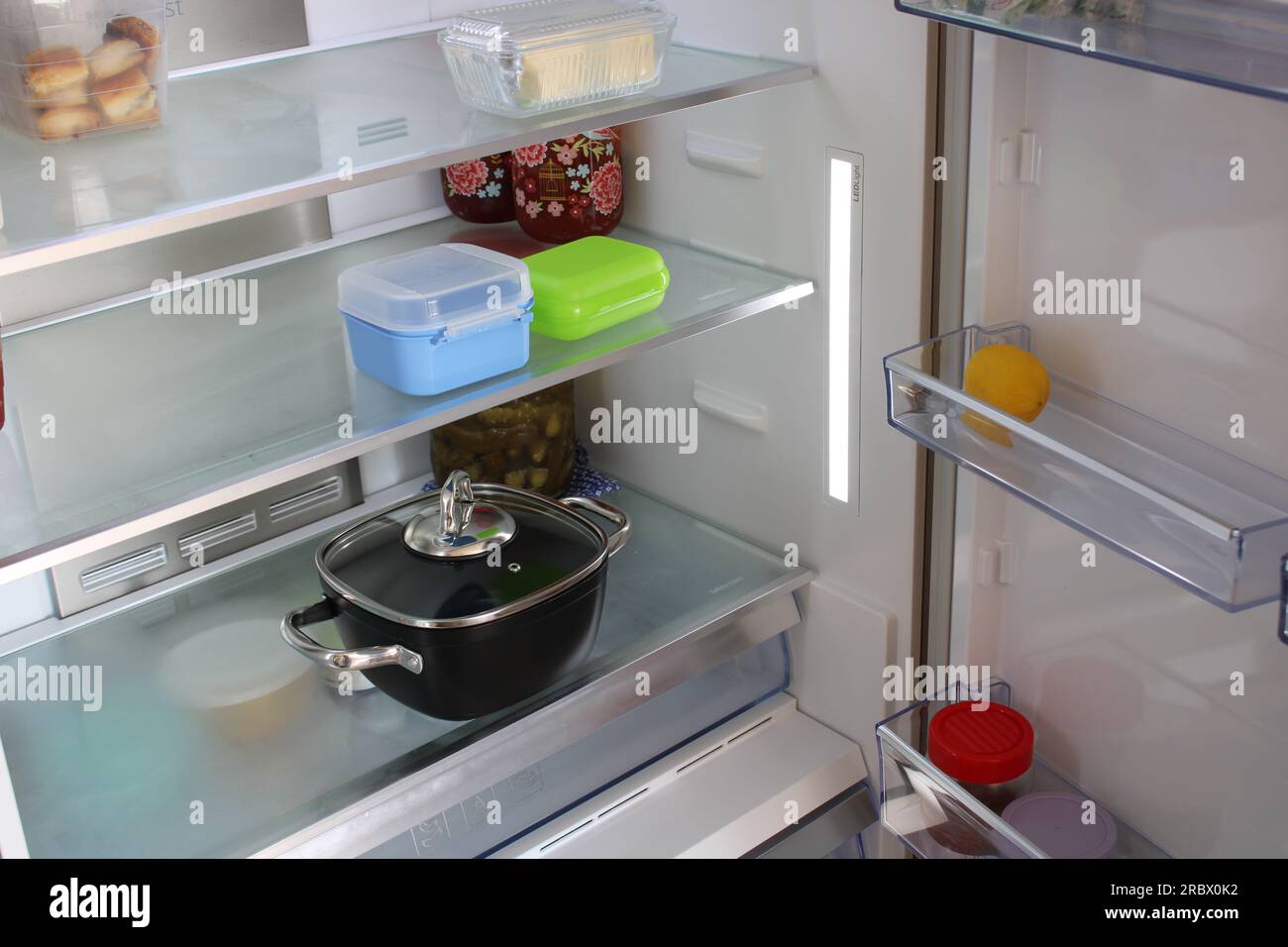 Empty refrigerator. Concept of poverty idea, food crisis, gluten allergy and celiac disease ...