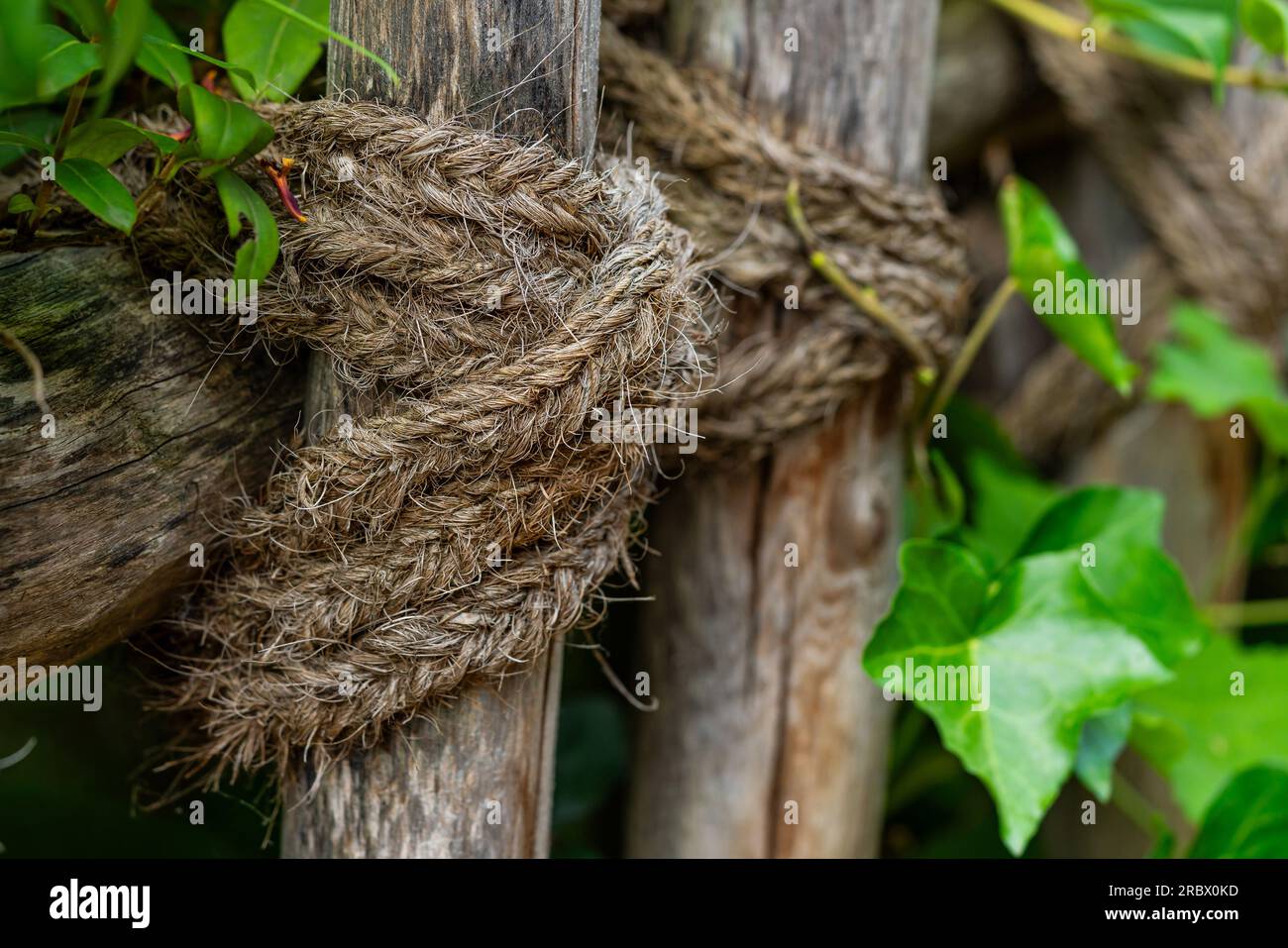 Old rope tied wooden pole hi-res stock photography and images - Alamy