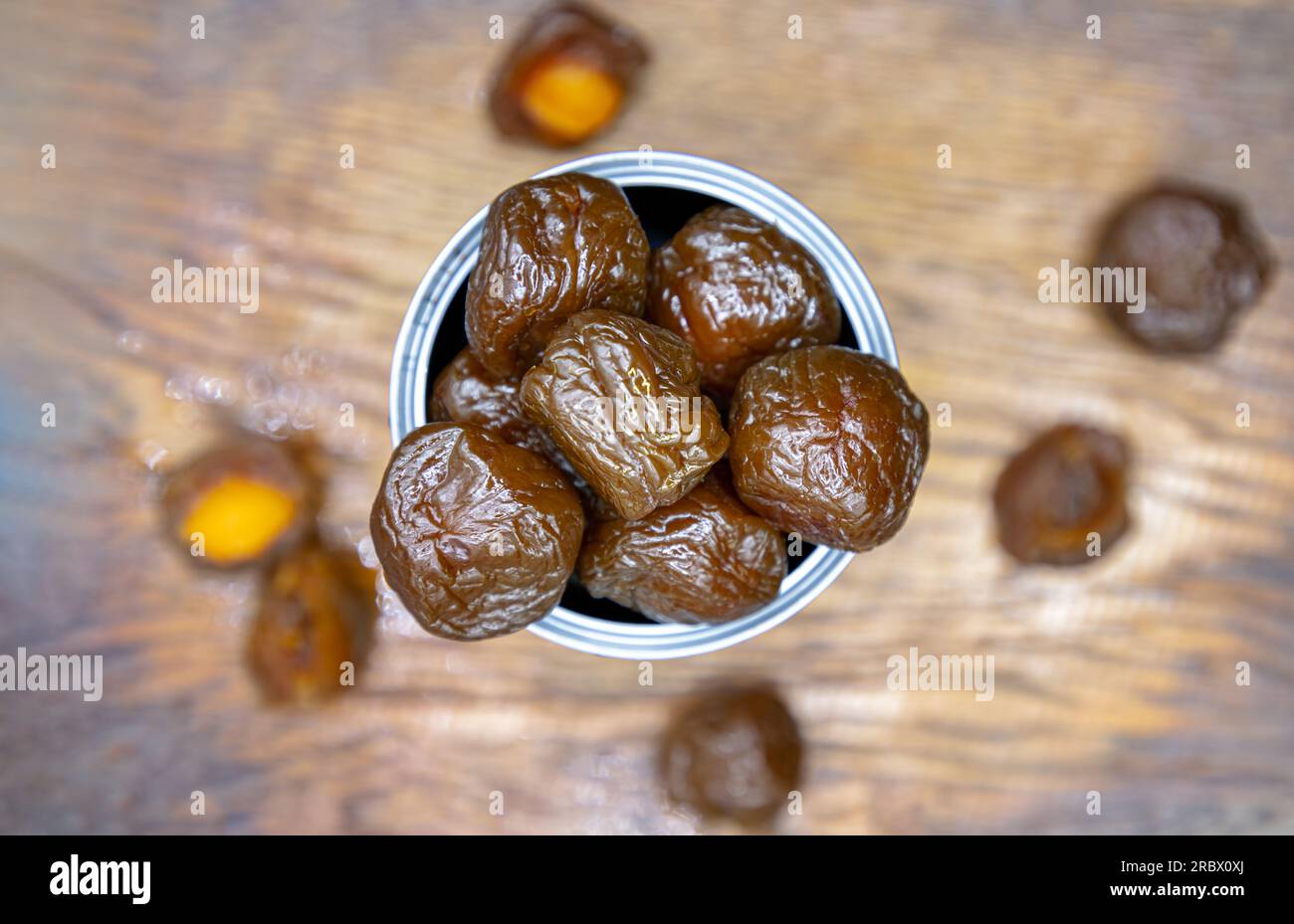 Flavored preserved chinese plums (Preserved fruits) in tin can on ...