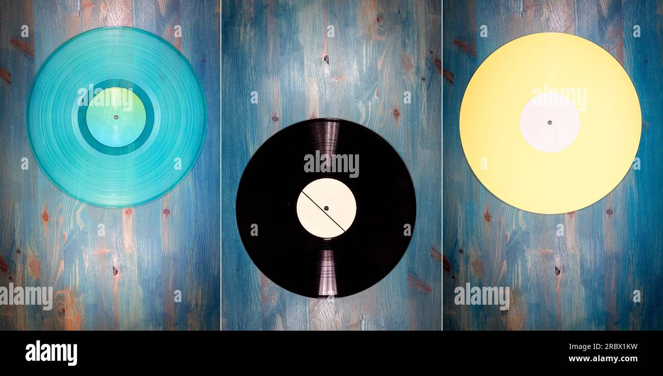 Collection of images with different color vinyl records on blue wooden ...