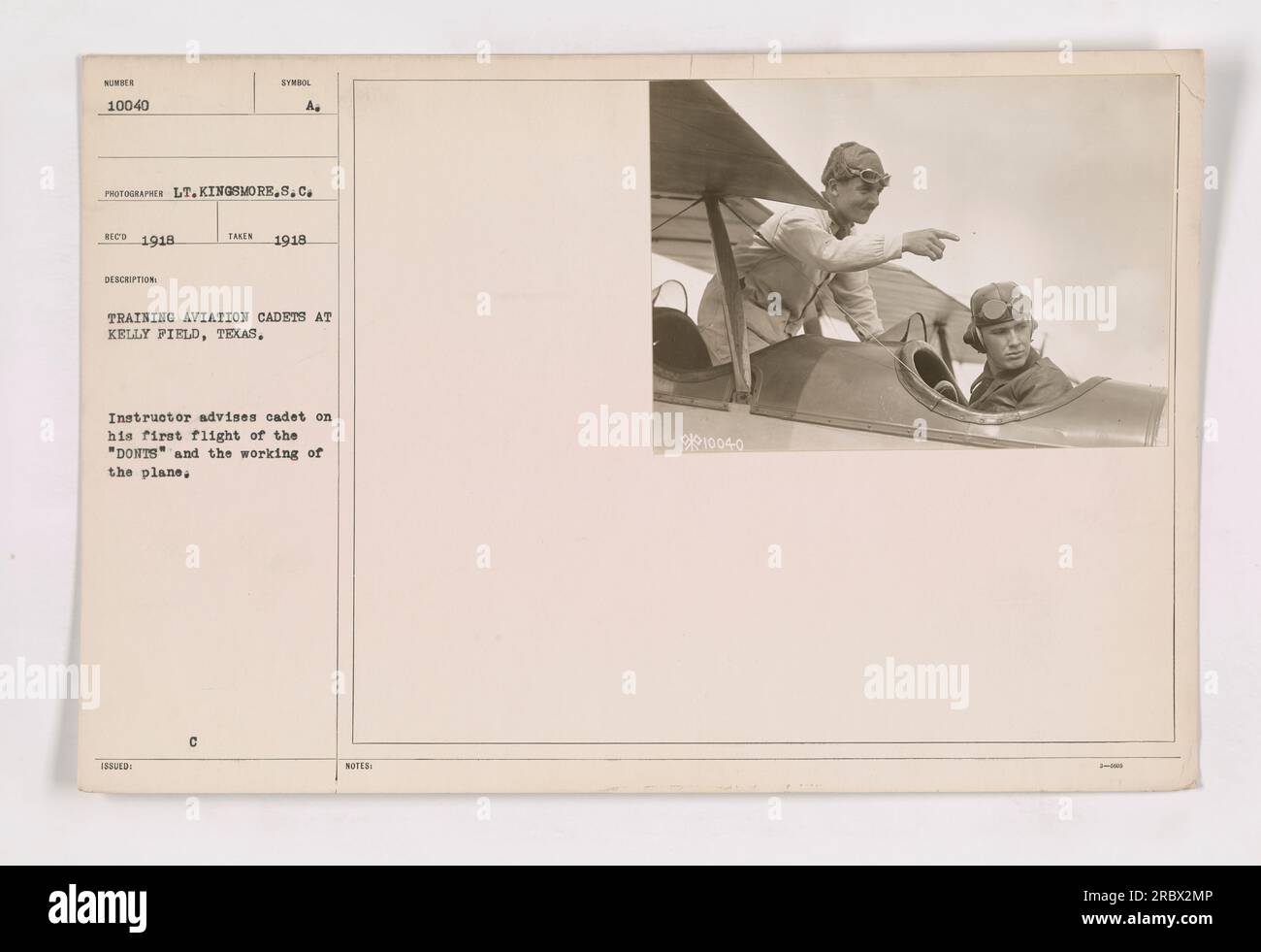 An aviation cadet receives instruction from an instructor before ...