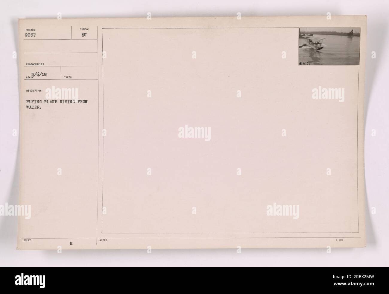 The photograph shows a military plane, with an issued symbol, taking ...