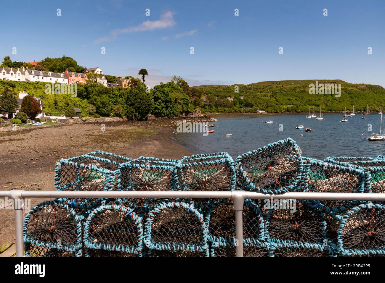 Portree, Isle of Skye, Scotland, UK. 5 June 2023. Portree harbour with lobster pots and ...
