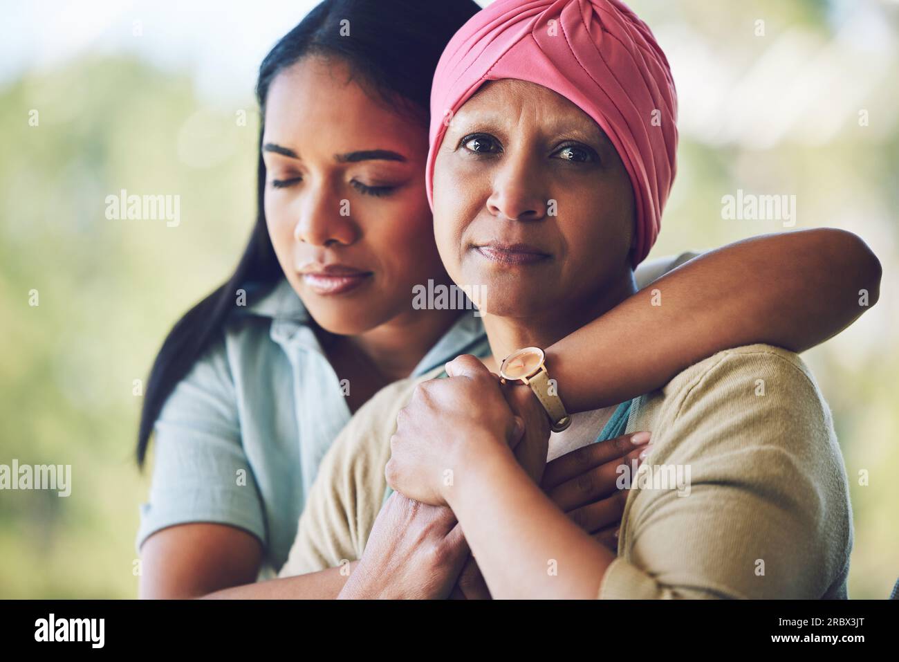 Love, hug and woman with her mother with cancer hugging, bonding and ...