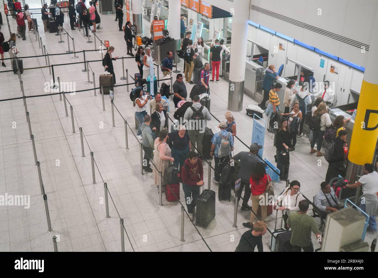 London UK. 11 July 2023 Passengers at Easyjet check in at Gatwick ...