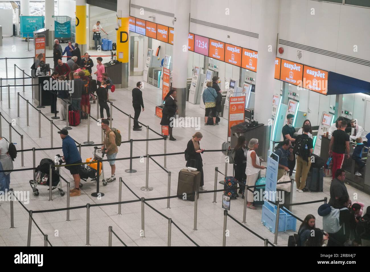 London UK. 11 July 2023 Passengers at Easyjet check in at Gatwick ...