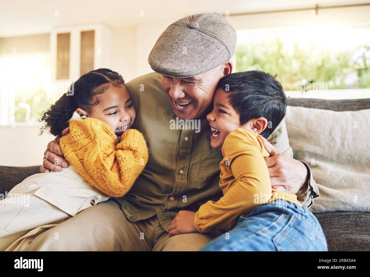 Hug, grandpa or happy kids laughing in family home on sofa with love ...