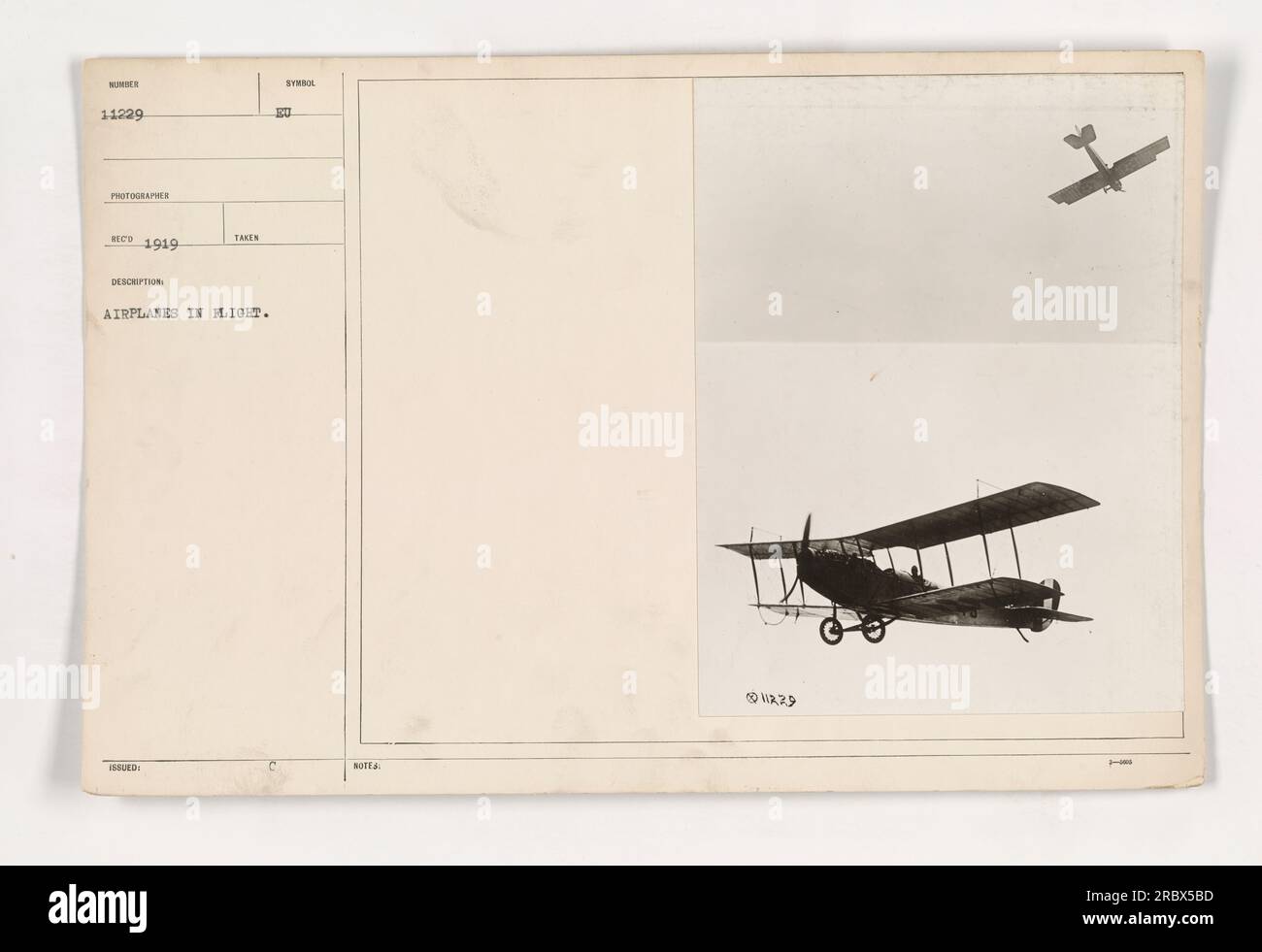 Image shows a group of biplane aircraft in flight. The photograph was ...