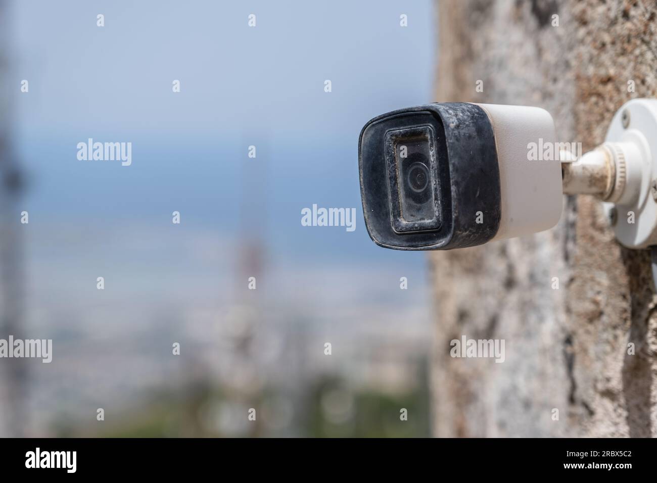 Old security camera on a wall Stock Photo - Alamy