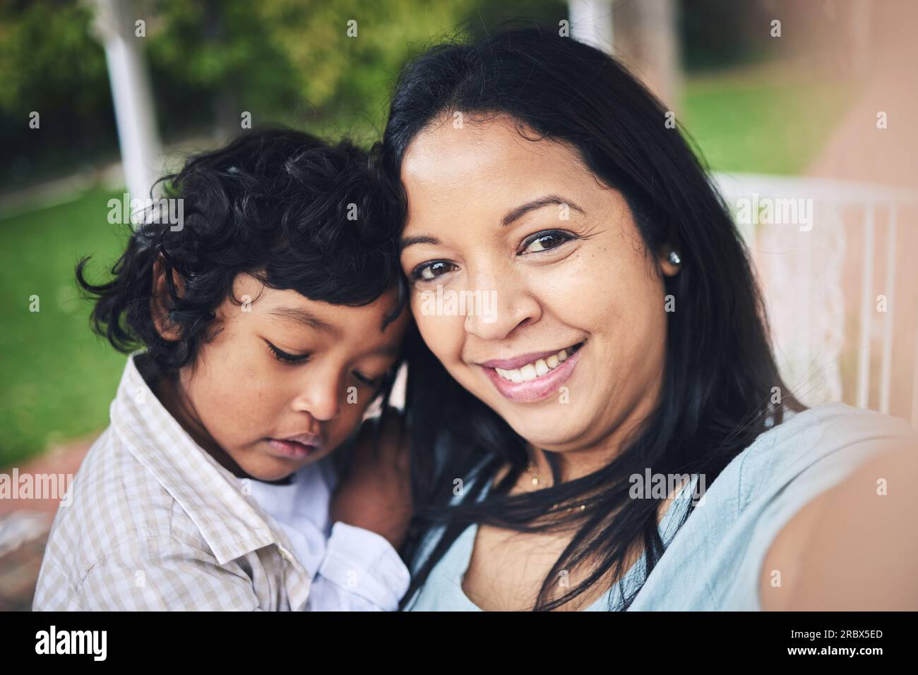 Face, selfie and mother smile with kid outdoor taking photo for happy ...