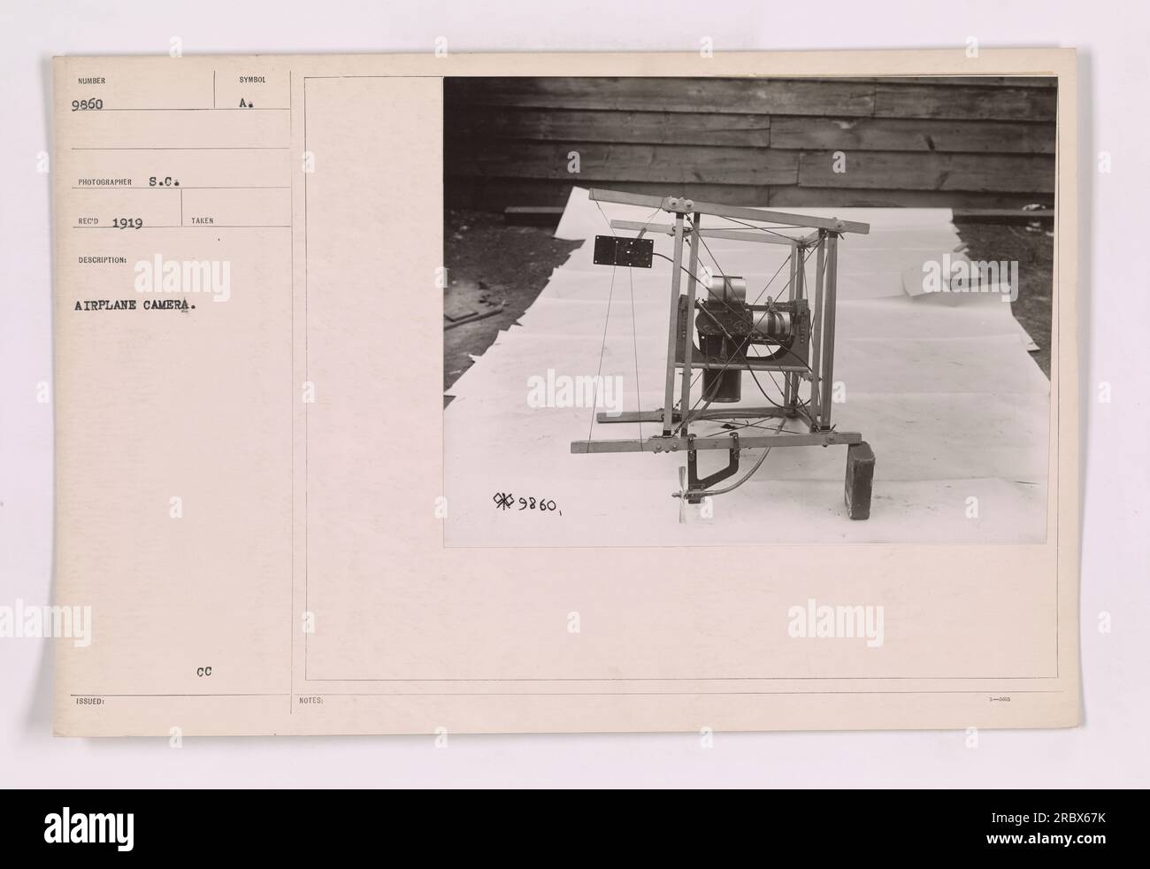 An American military personnel uses an airplane camera in 1919. The ...