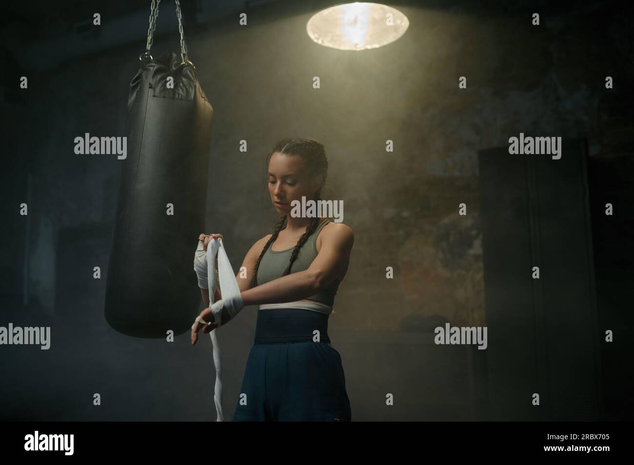 Female boxer wrapping hand bandage hi-res stock photography and images ...