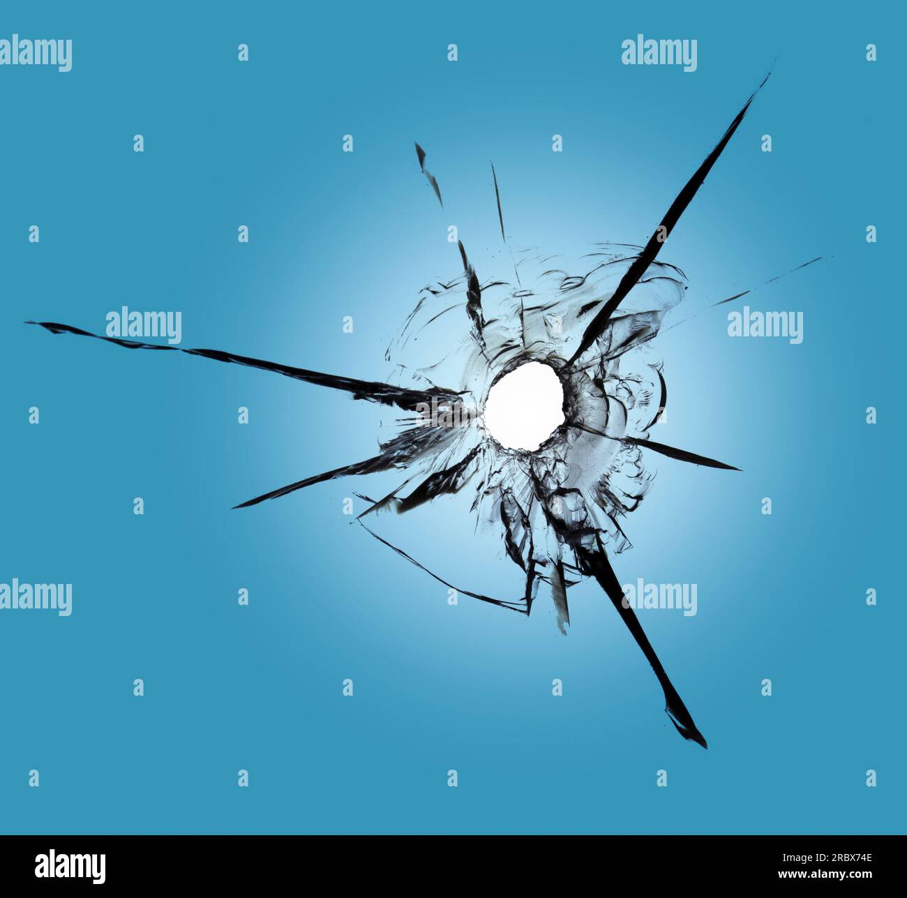 Bullet holes in the window against the blue sky. Consequences of ...