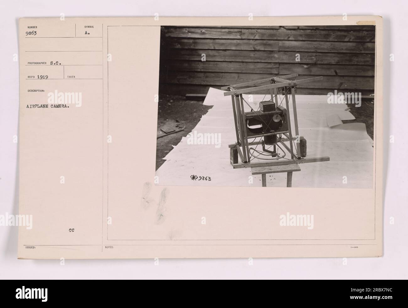 A black and white photograph of an airplane camera, MINGER 9863, taken ...