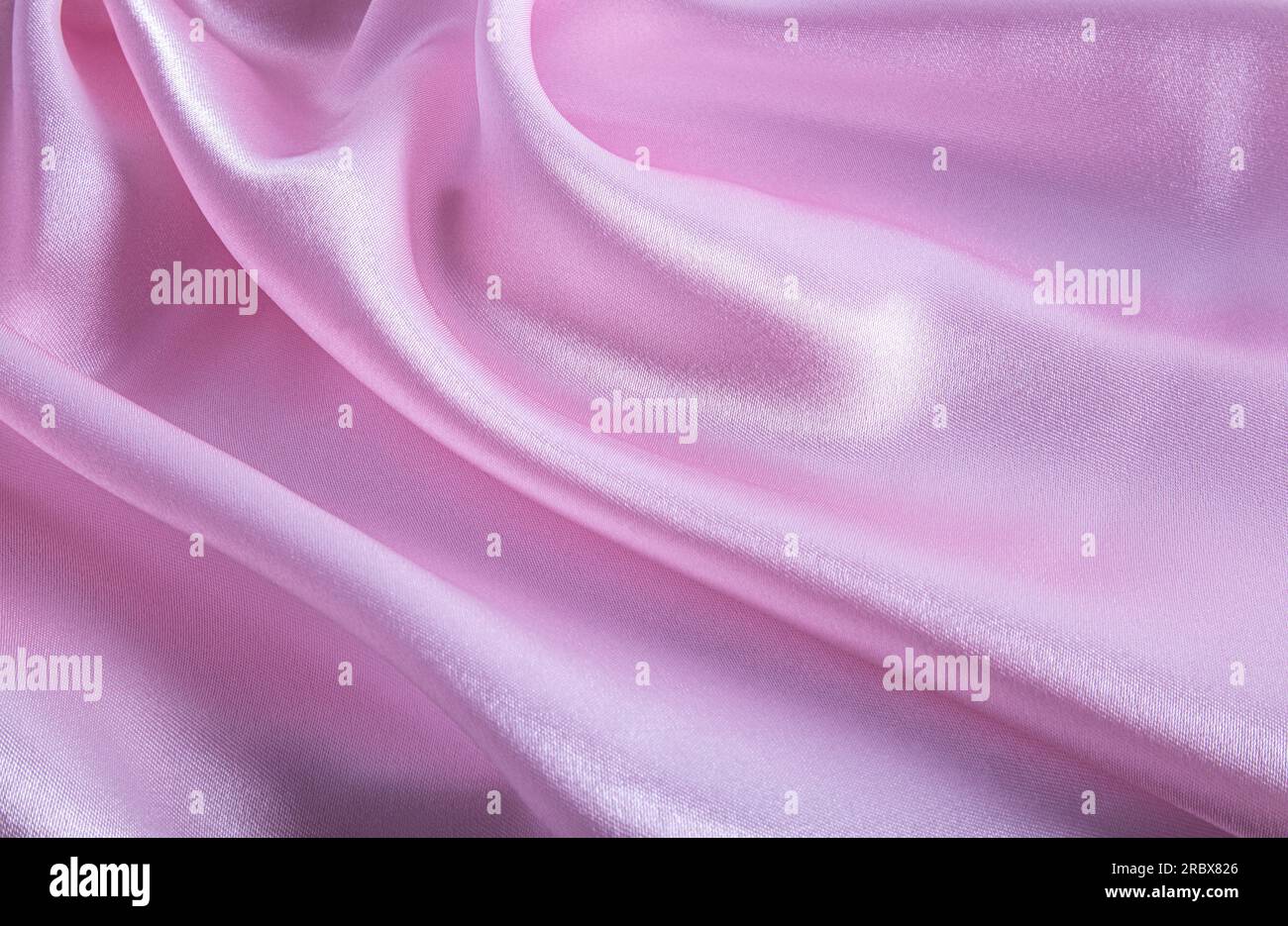 The delicate texture of the elegant folds of lavender-colored satin ...