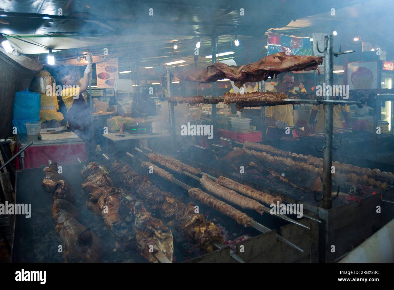 “Porceddu” Small Roasted Pig on the spit, “Cordula” made up of braided ...