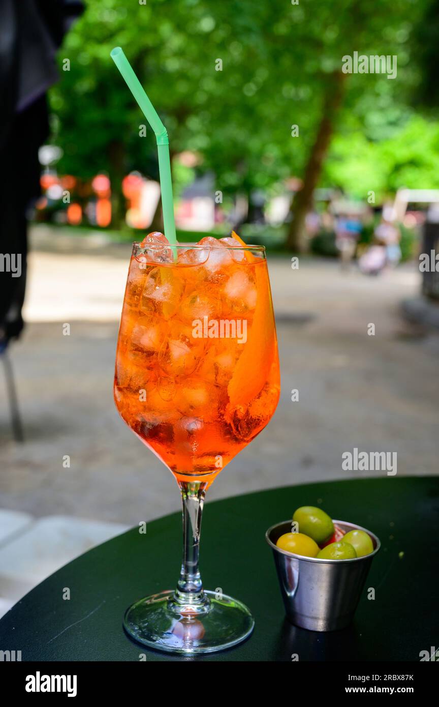 Waiter prepared the Aperol Sprits summer cocktail with Aperol, prosecco ...