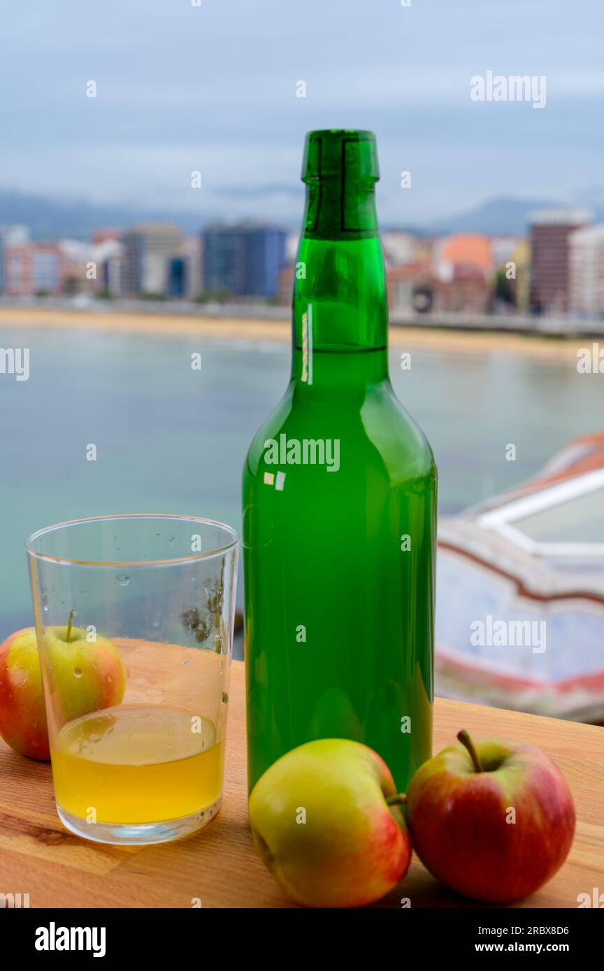 Traditional natural Asturian cider made from fermented apples in wooden ...