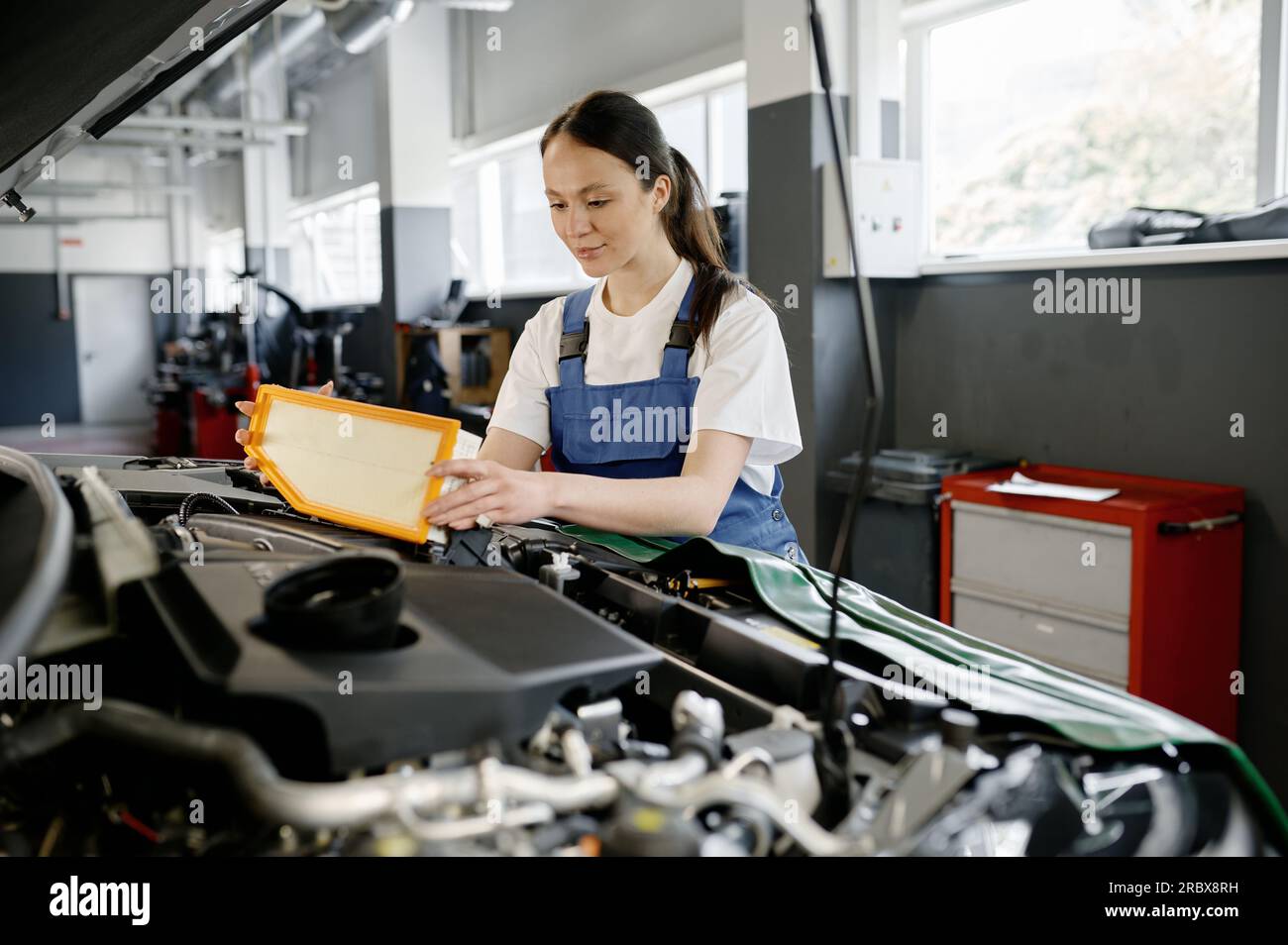 Woman changing filter in hi-res stock photography and images - Alamy