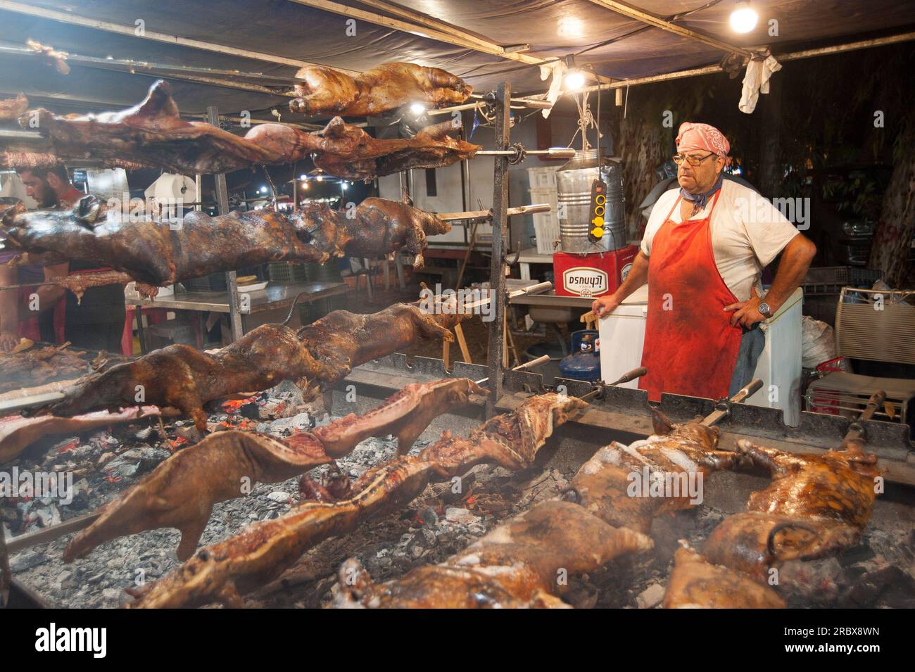 Porceddu, roast baby pork wrapped around a spit, typical Sardinia ...