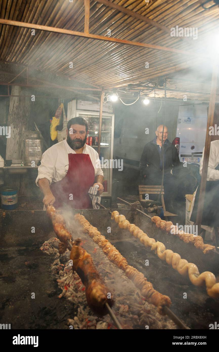 Porceddu, roast baby pork wrapped around a spit, “Cordula” made up of ...