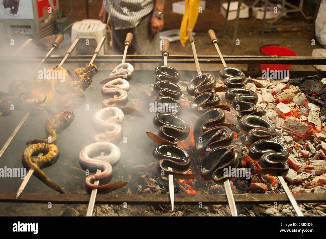 Eels on the spit, typical Sardinia recipe, Campidano, Sardinia, Italy ...