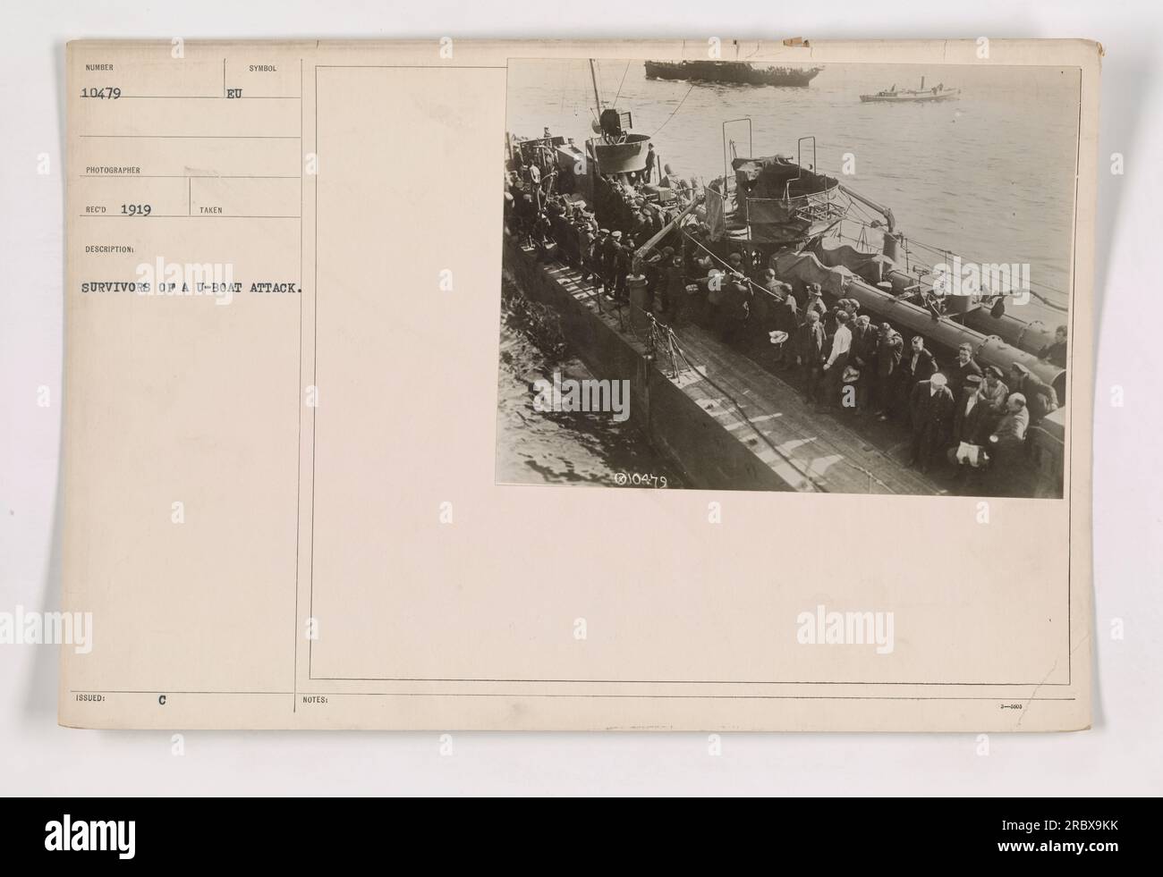 Survivors of a U-Boat attack rest aboard a ship. They are looking weary ...