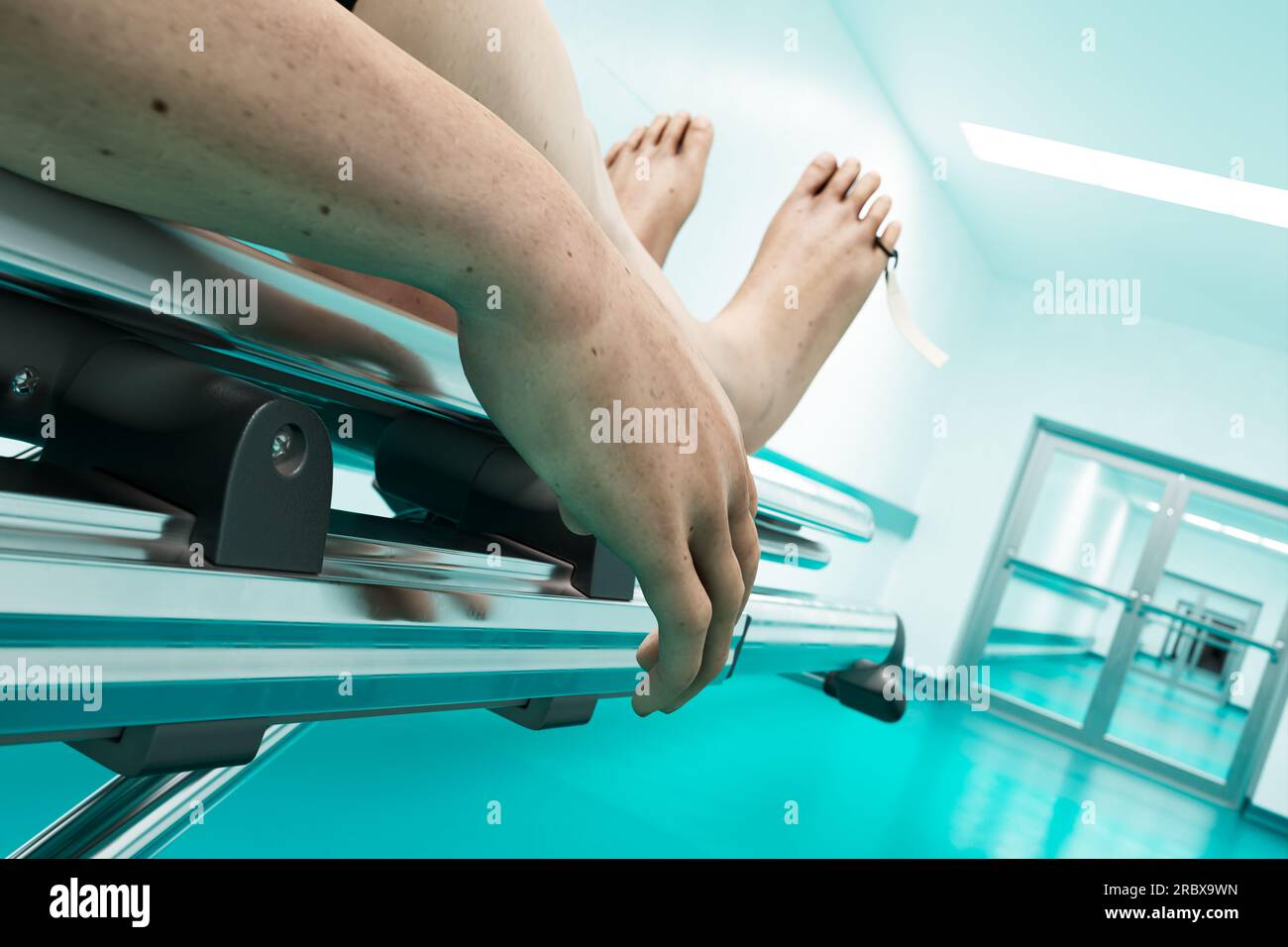 A dead man on a metal hospital bed on the hallway. Corps on a gurney ...