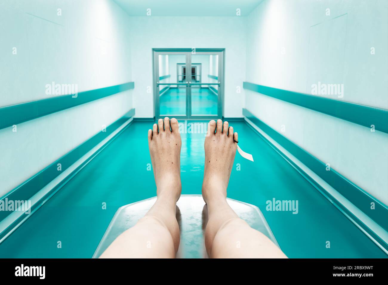 A dead man on a metal hospital bed on the hallway. Corps on a gurney ...