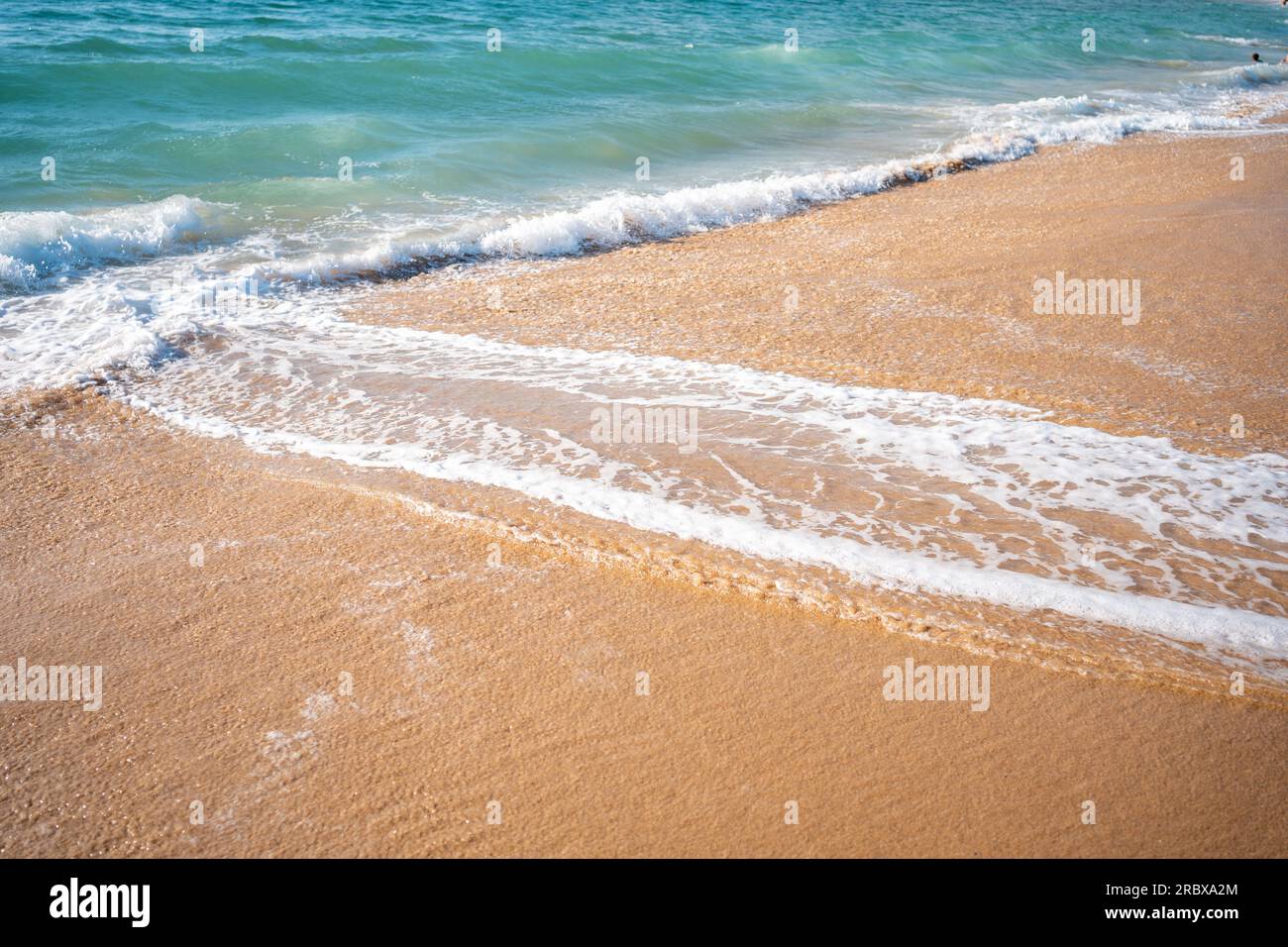 Soft beautiful ocean wave on sandy beach. Background. Turquoise color ...