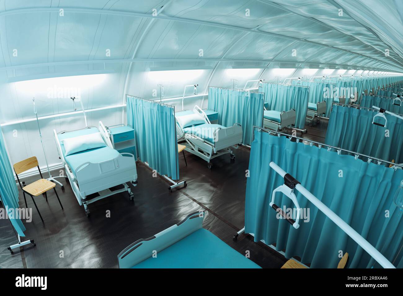 Rows of hospital beds separated by curtains in a field hospital. Empty ...
