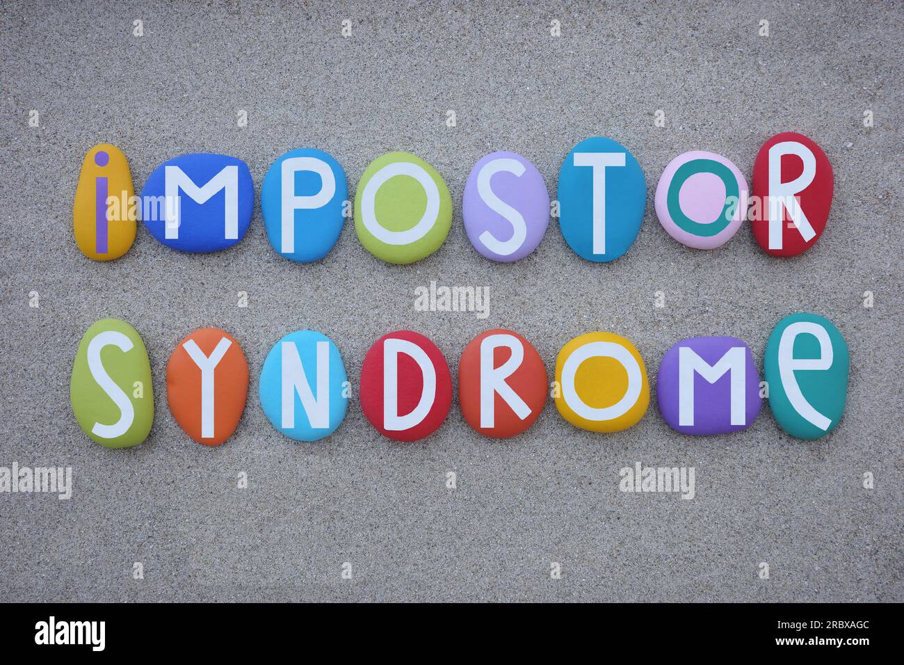 Impostor syndrome, creative text composed with multi colored stone ...