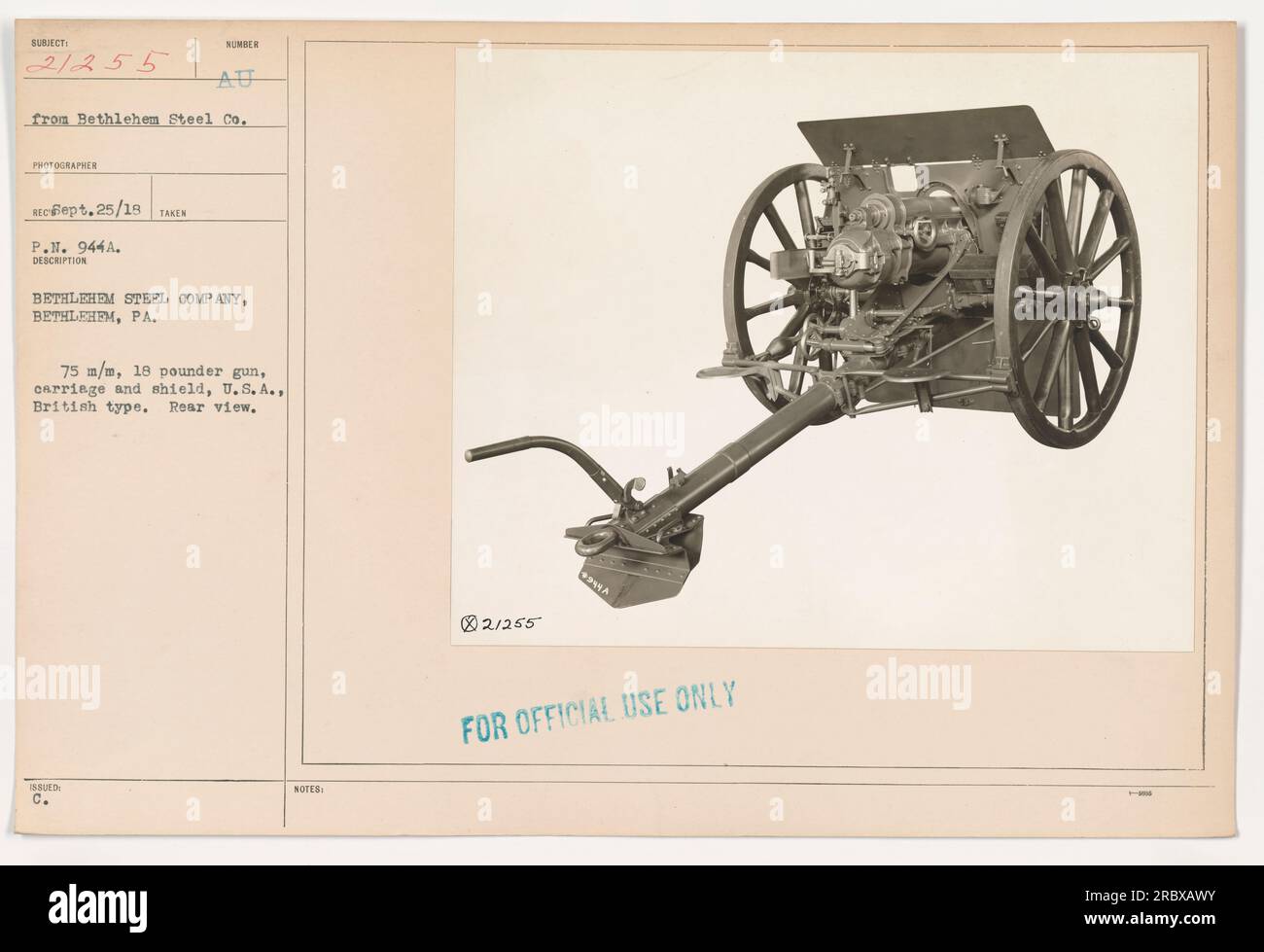 Soldiers working on assembling a 75mm, 18-pounder gun with carriage and ...