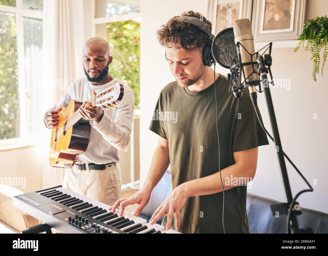 Piano, recording music and friends with guitar in home studio together ...