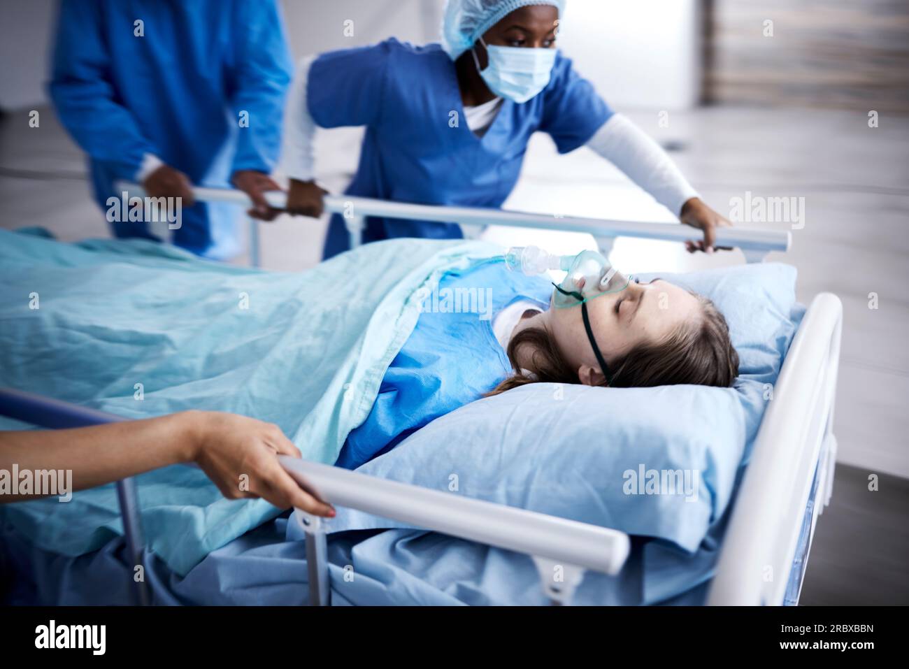 Hospital, bed and patient with doctors running in surgery, emergency ...