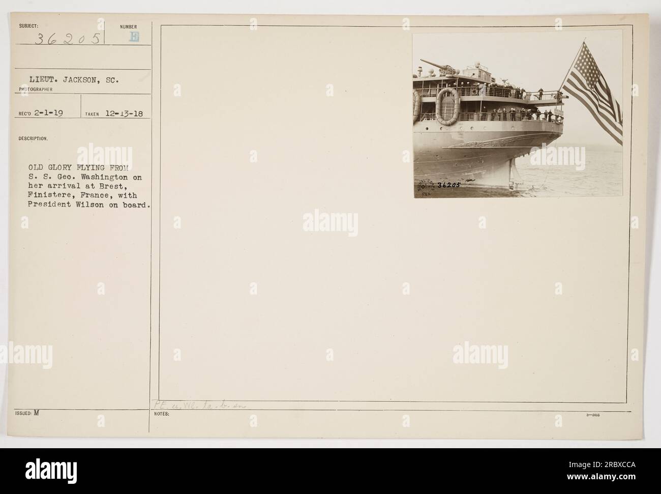 Lieutenant Jackson takes a photograph of the U.S. Battleship George ...
